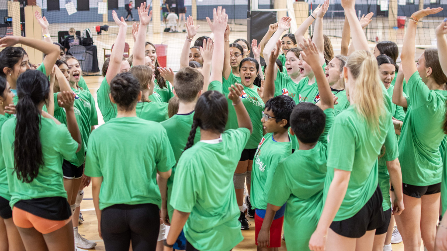 Team huddle youth volleyball boys and girls