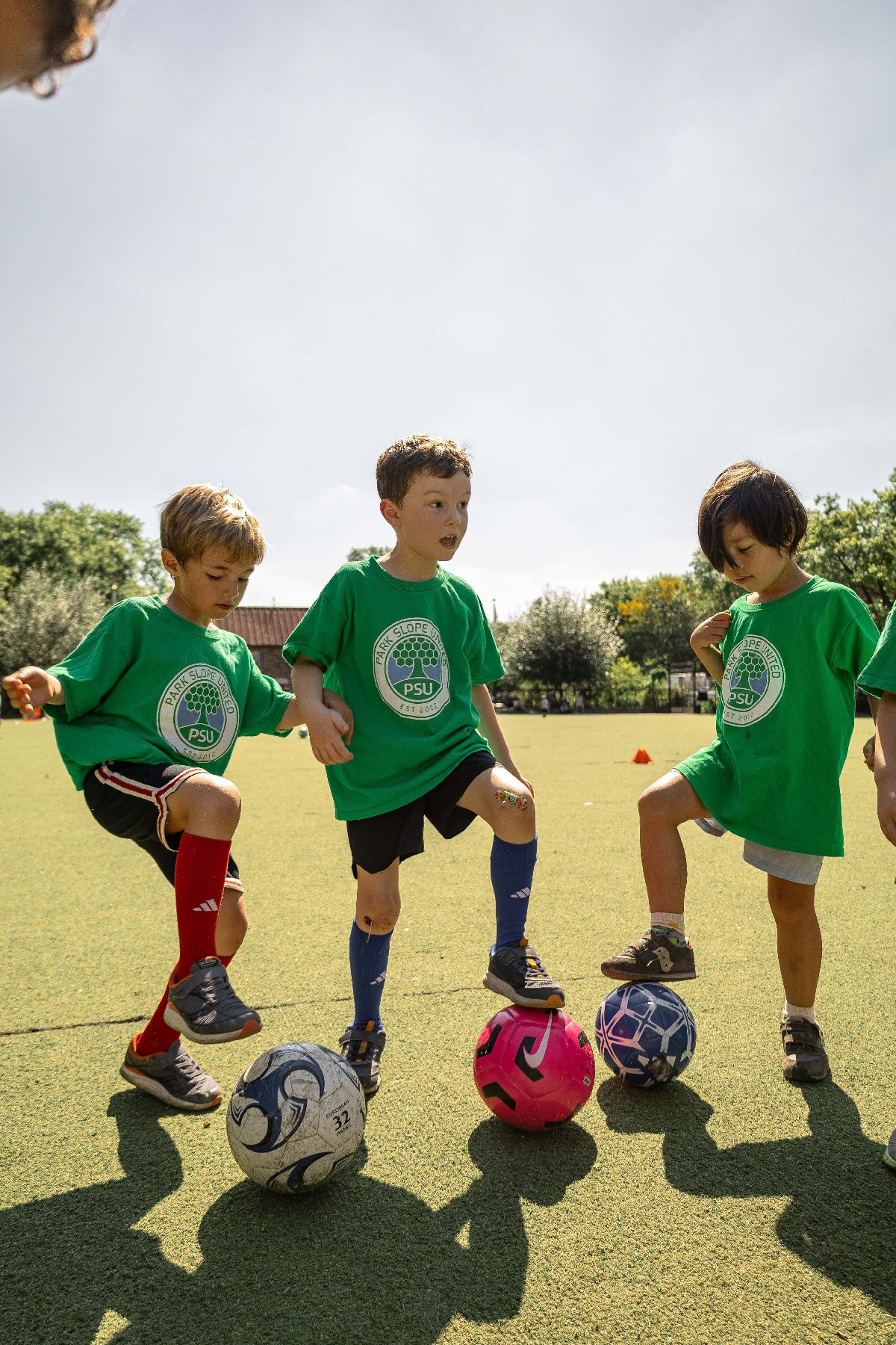kids with soccer balls in a soccer class